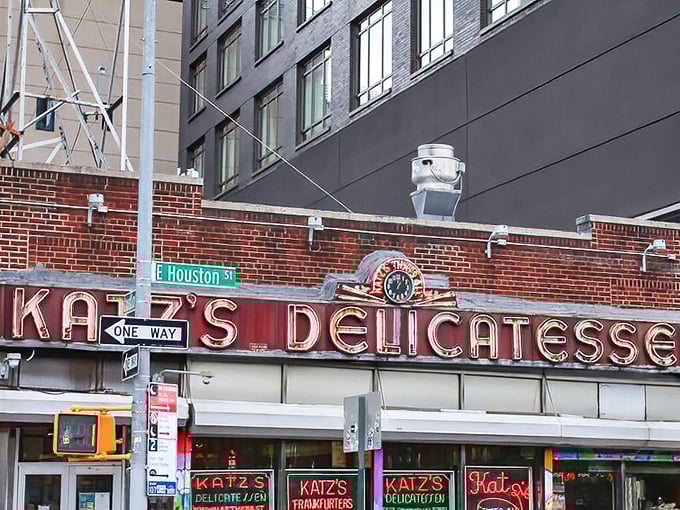 The iconic neon sign of Katz's Delicatessen glows like a beacon for hungry souls on Houston Street, a timeless landmark in a constantly changing city.