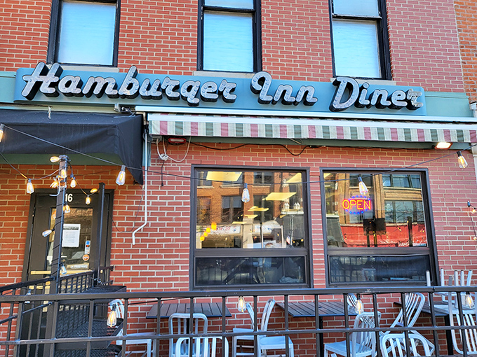 The retro signage of Hamburger Inn Diner beckons like an old friend on Delaware's Winter Street, promising comfort and satisfaction behind that cheery neon glow.