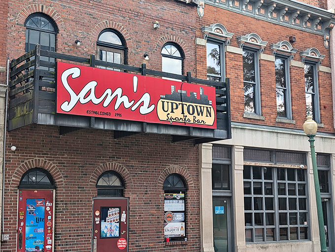 The iconic red sign of Sam's Uptown beckons like a culinary lighthouse on Washington Street, promising good times and even better food in downtown Charleston.
