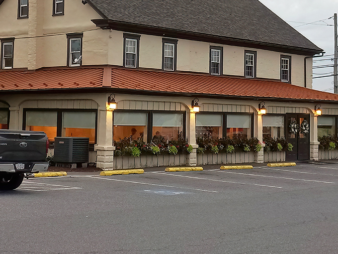 The historic charm of Brickerville House Restaurant beckons from the roadside, its copper-hued awning and flower boxes promising comfort before you even step inside.