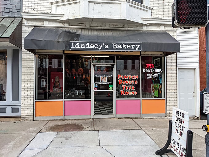 The unassuming storefront of Lindsey's Bakery beckons with its vintage charm and colorful panels. Donut paradise awaits behind that glass door.
