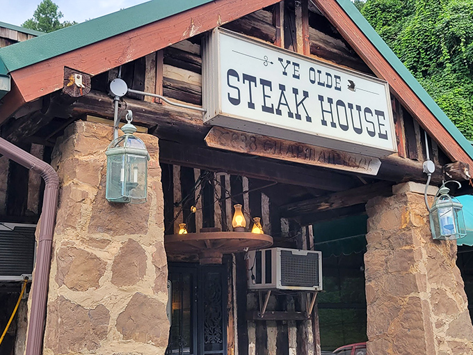 The rustic stone facade of Ye Olde Steak House stands like a carnivore's cathedral, promising meaty salvation to all who enter its hallowed doors.