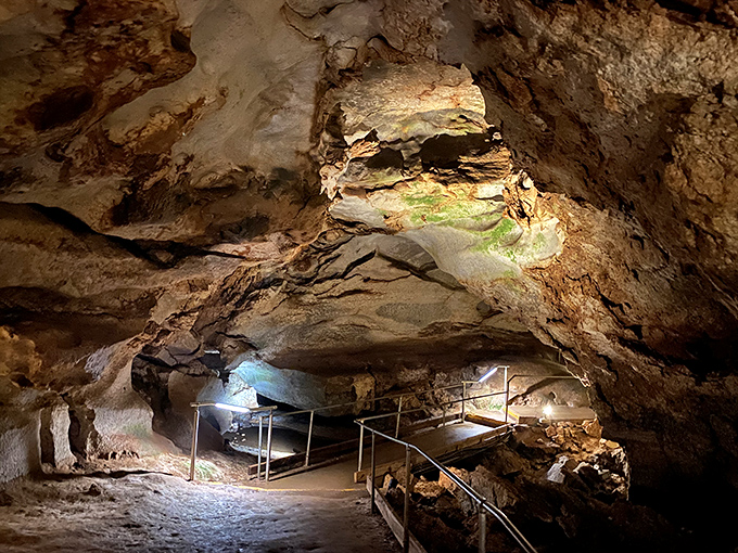 Nature's own cathedral awaits below ground. The dramatic lighting transforms ancient alabaster formations into a subterranean art gallery millions of years in the making.