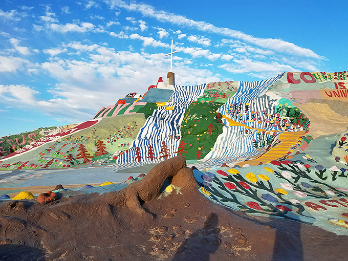 The desert's most colorful surprise awaits! Salvation Mountain rises from the barren landscape like a rainbow-frosted cake that forgot to stop at one layer.