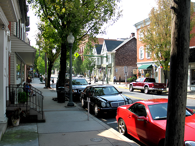 East Main Street beckons with its tree-lined charm and inviting storefronts. Aaron's Books stands ready to transport bibliophiles to literary worlds beyond.