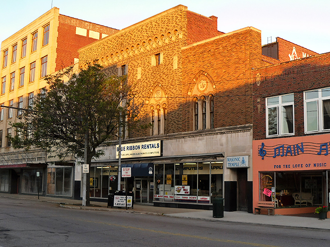 Downtown Ashtabula glows with golden-hour charm, its historic brick buildings standing as testaments to a simpler time when Main Streets were the heart of America.