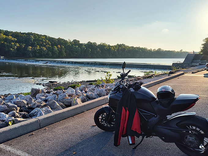 Mother Nature's perfect postcard: The dam creates a gentle cascade across the Maumee River, while a motorcycle stands ready for the next scenic bend in the road.