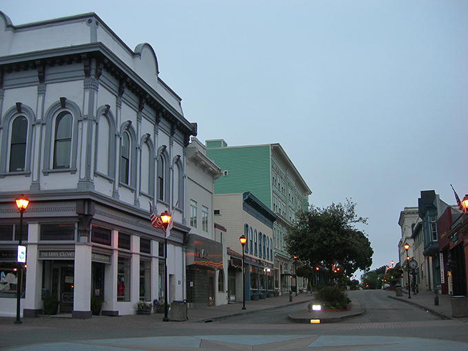 The misty morning streets of Eureka's Old Town, where Victorian buildings wait patiently for the fog to lift and reveal their ornate details.