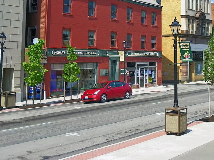 Vibrant red brick storefronts line Waynesburg's main street, where historic charm meets small-town practicality. The kind of place where even traffic lights seem unhurried.