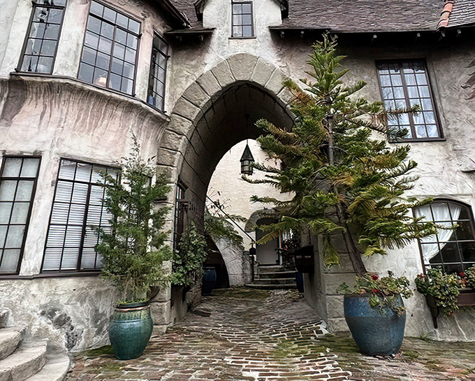 Stone archways and weathered walls create an entrance that would make medieval architects weep with envy.