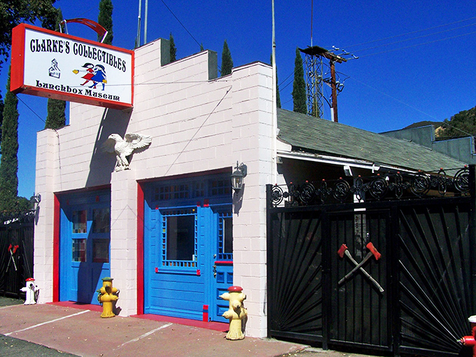The unassuming white exterior with its red trim and towering cypress trees gives no hint of the technicolor nostalgia explosion waiting inside.