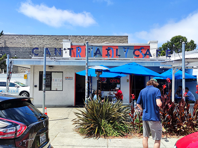 The iconic blue and red signage of Rudy's Can't Fail Cafe stands as a beacon for breakfast pilgrims. Even on the sunniest California days, it promises comfort inside.