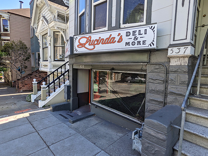 A sandwich sanctuary nestled in classic San Francisco architecture. Lucinda's storefront promises culinary treasures behind those bright orange doors.