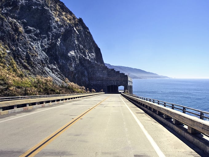 The highway tunnel carved into the mountainside feels like driving through a portal to paradise. Mother Nature's grand entrance to Big Sur's coastal wonderland.