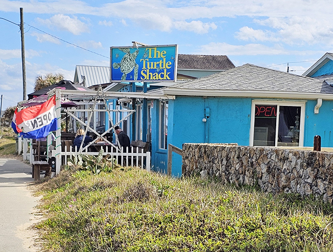 The vibrant turquoise exterior of Turtle Shack Cafe stands out like a beacon for hungry travelers. Florida coastal dining at its unpretentious best.