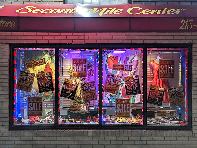 The bright red awning of Second Mile Center beckons like a lighthouse for bargain hunters, promising treasures within its unassuming brick exterior.