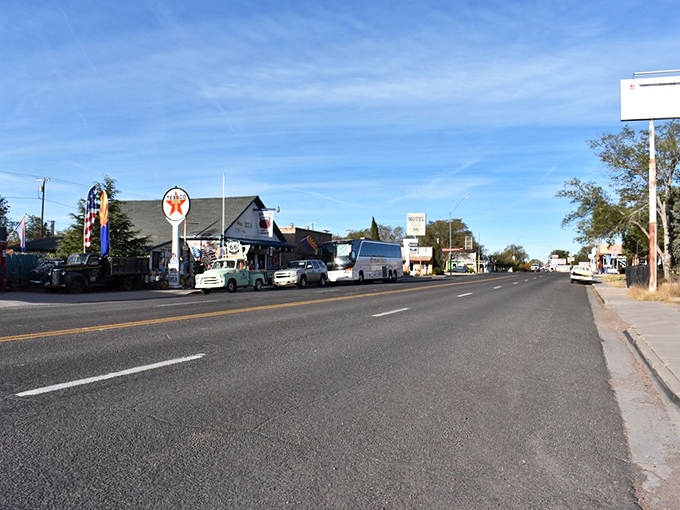Route 66 stretches before you like a ribbon of possibilities, with Seligman's vintage storefronts standing as colorful sentinels of simpler times.