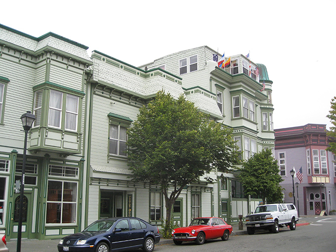 The Pink Lady mansion stands like a Victorian confection against the California sky &ndash; proof that sometimes architecture deserves its own Instagram account. 