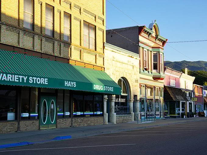 Downtown Paonia sits like a movie set against the dramatic backdrop of mountains, where storm clouds gather but never dampen the town's charm.