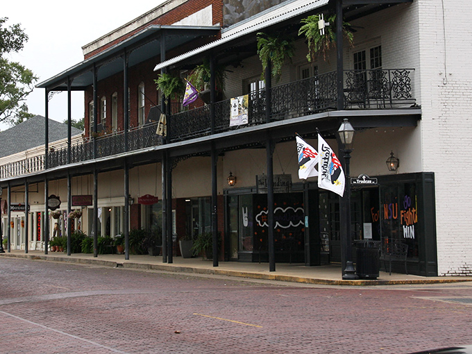 Brick streets and historic buildings—Natchitoches' Front Street feels like stepping into a time machine where modern cars look oddly out of place.