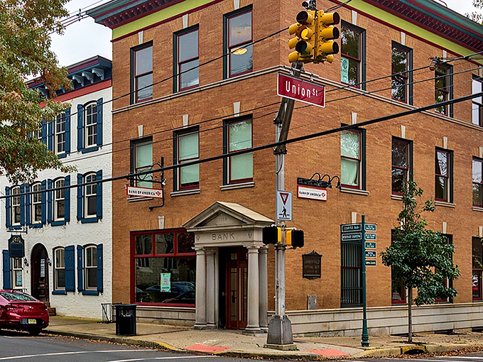 Bridge Street buzzes with small-town charm while the colorful "Lambertville" banner welcomes visitors to this riverside gem.