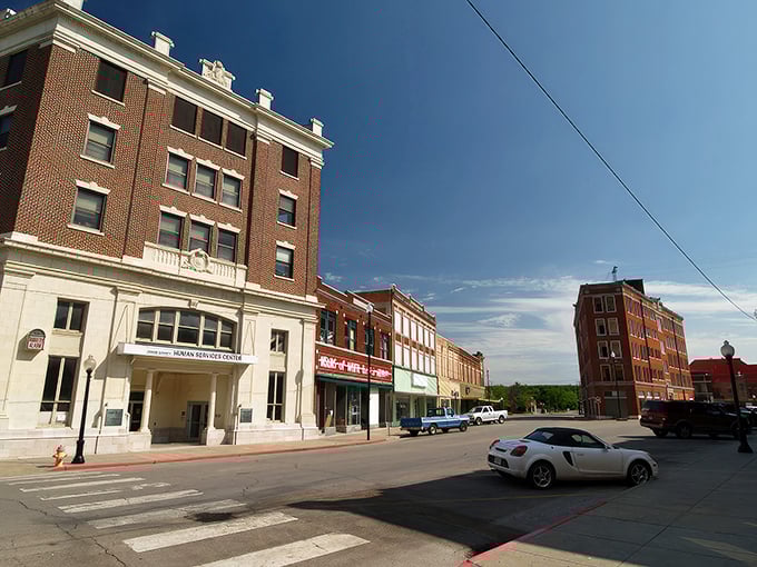Historic brick buildings line Pawhuska's main street, telling stories of boom times and quiet years while standing proudly against the Oklahoma sky.
