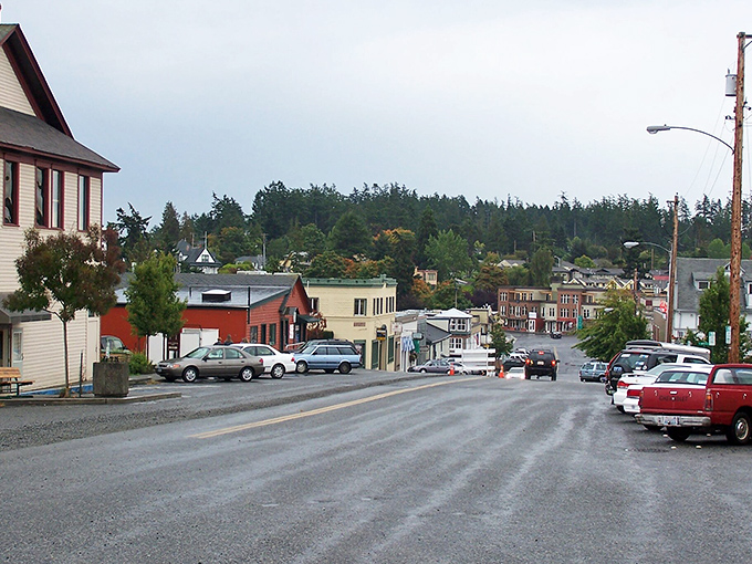 Spring Street stretches before you like a Norman Rockwell painting come to life, where island pace replaces mainland rush and every storefront tells a story.