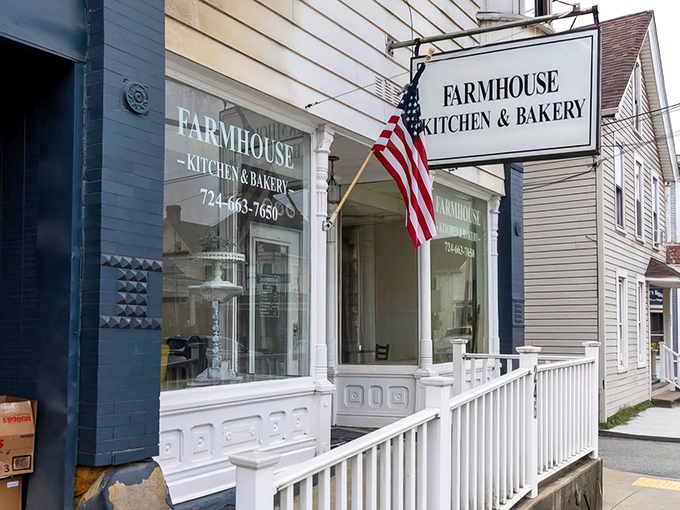 The classic American flag waves proudly outside this charming white storefront, where breakfast dreams come true and calories don't count until tomorrow.