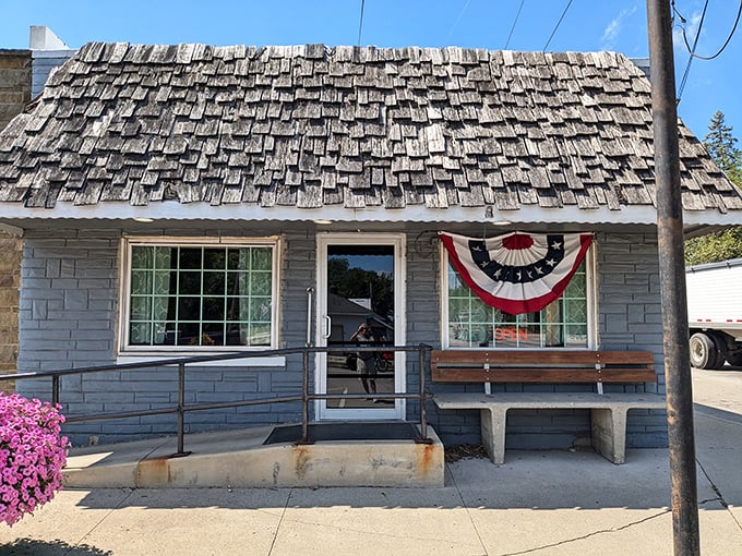 The weathered wooden shingle roof and patriotic bunting tell you everything &ndash; this isn't just a restaurant, it's a slice of Americana waiting to be savored.