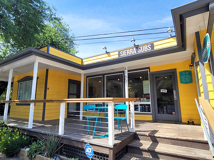 The sunshine-yellow exterior of Sierra Subs stands like a beacon of hope for hungry travelers, promising sandwich salvation just steps from Sequoia National Park.