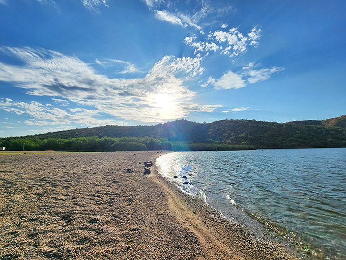 Where desert meets shoreline in a geographical plot twist that would make M. Night Shyamalan jealous. Arizona's secret beach beckons with crystalline waters and rugged mountain backdrops.