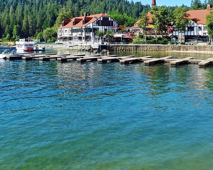 The crystal-clear waters of Lake Arrowhead meet charming Tudor-style architecture, creating a postcard-perfect scene that whispers "European vacation" without the passport hassle.