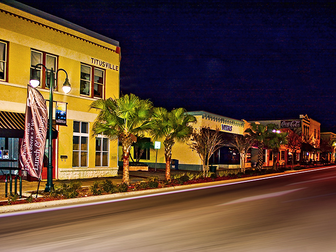 Downtown Titusville glows with warm possibility at night, where historic buildings and palm trees create an affordable slice of Florida paradise. 