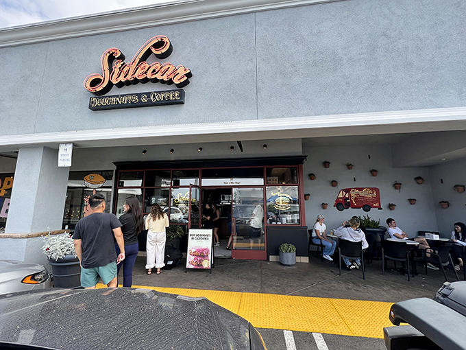 The copper-toned Sidecar sign beckons like a lighthouse for donut lovers. Worth the pilgrimage to Costa Mesa for what awaits inside.