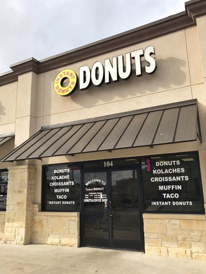 The unassuming storefront of Instant Donuts stands like a beacon of hope for carb enthusiasts. No fancy frills, just the promise of delicious donuts waiting inside.