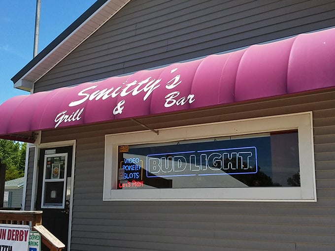 The pink awning of Smitty's beckons like a neon promise in rural Illinois&mdash;small-town charm with big-time flavor waiting just beyond that door.