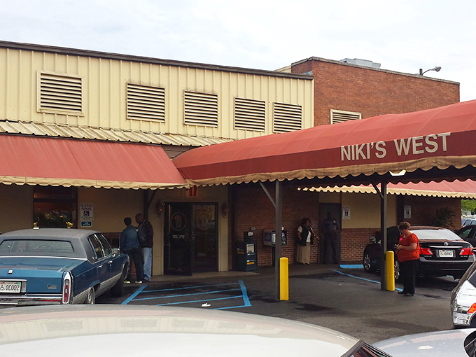 The unassuming exterior of Niki's West stands like a culinary lighthouse on Finley Avenue, beckoning hungry Alabamians with its "Unique Southern Restaurant" promise since 1957.