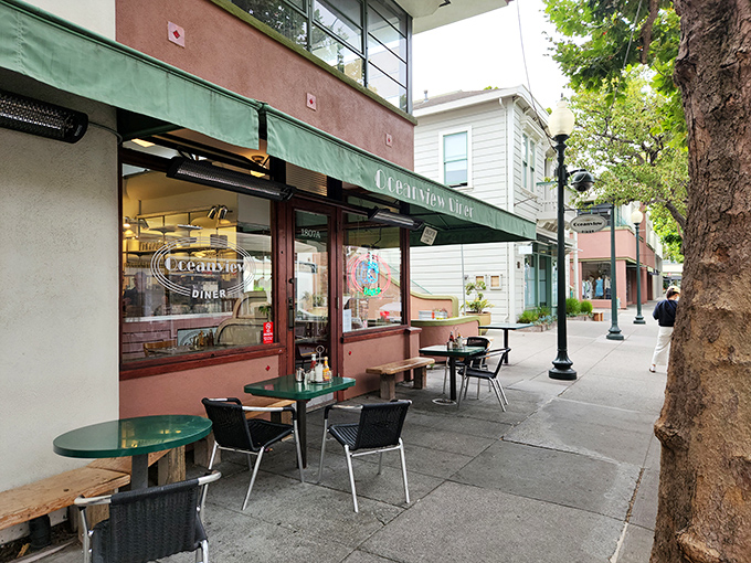 The unassuming green awning of Oceanview Diner beckons like a time portal to simpler days when conversation trumped smartphones and meatloaf reigned supreme.