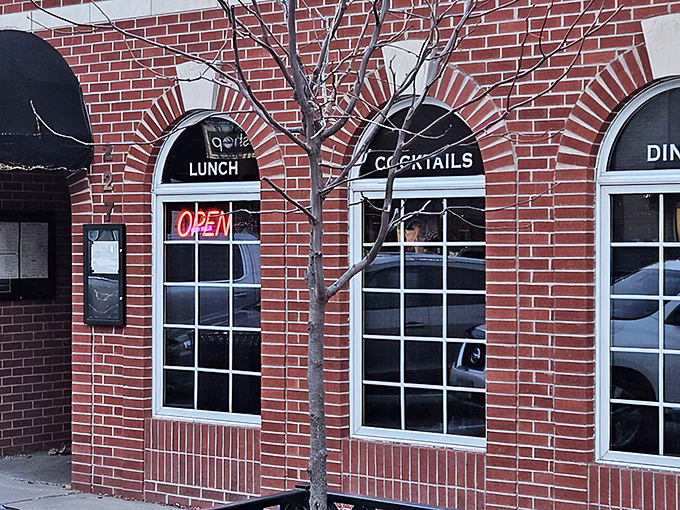 Classic brick charm meets modern comfort at Cooper's on 5th, where "LUNCH" and "COCKTAILS" promise double the happiness. 