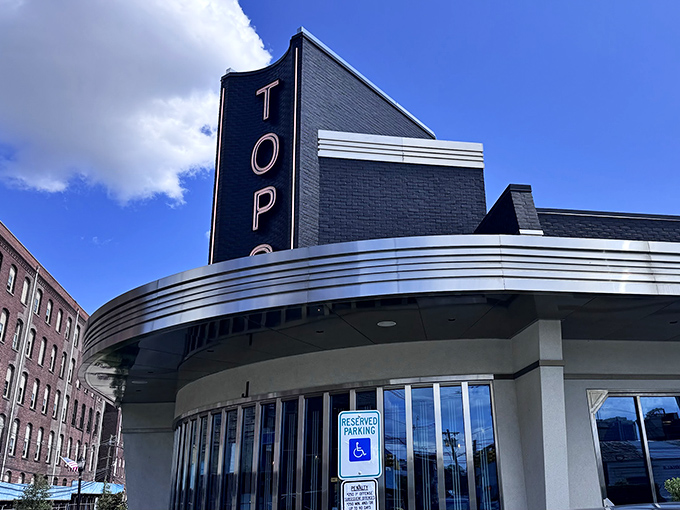 The iconic blue and silver fa&ccedil;ade of Tops Diner stands proudly against the New Jersey sky, like a beacon calling hungry travelers home.