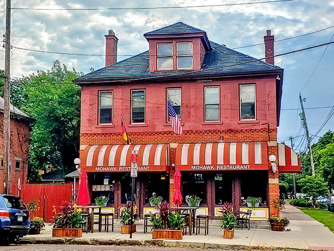That iconic striped awning isn't just a canopy—it's a beacon for hungry souls wandering German Village after dark. Comfort food salvation awaits.