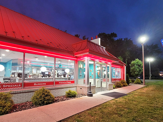 The red-roofed Pottsville Diner glows like a beacon in the night, promising comfort food salvation to hungry travelers and locals alike.