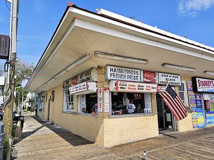 The unassuming yellow-brick exterior of Gus & Gus Place stands as a Rehoboth Beach landmark, proudly serving boardwalk classics since the Eisenhower administration.