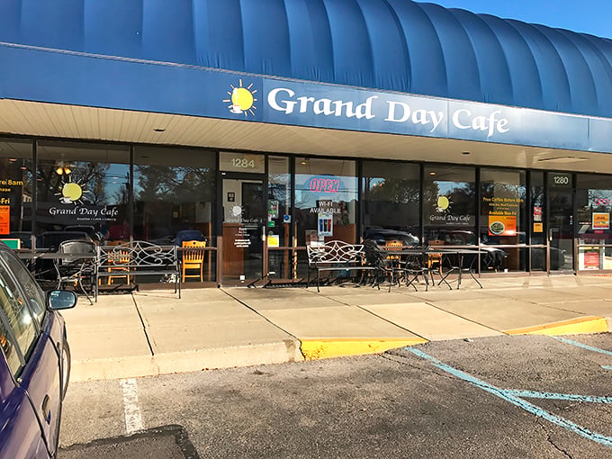 Like a beacon of breakfast hope, Grand Day Cafe's blue awning signals salvation for hungry Columbus locals seeking their morning hash brown fix.