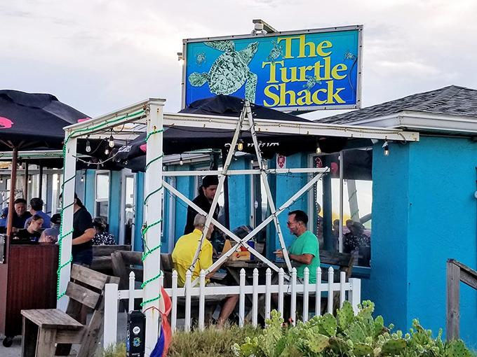 The vibrant turquoise exterior of Turtle Shack Cafe stands out like a beacon for hungry travelers. Florida coastal dining at its unpretentious best.