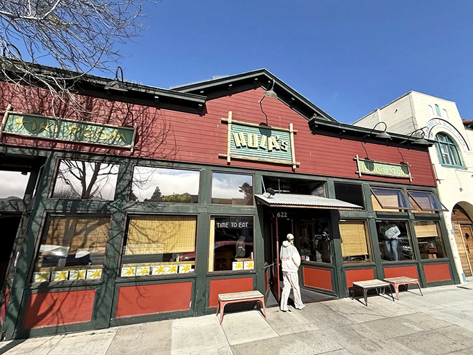 The distinctive red exterior of Hula's Island Grill stands out on Lighthouse Avenue like a tropical postcard inviting you to step inside and escape to island time.