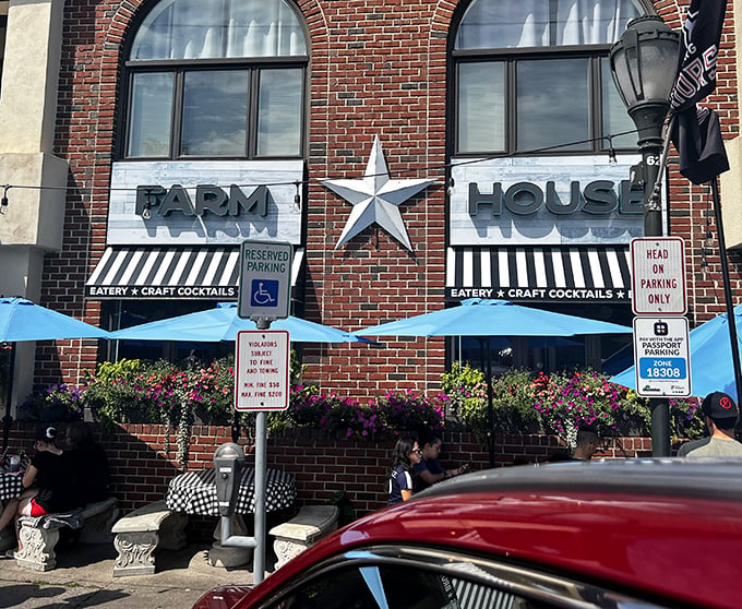 The iconic silver star between "FARM" and "HOUSE" isn't just decoration&mdash;it's a beacon calling hungry travelers to this brick-fronted culinary haven.