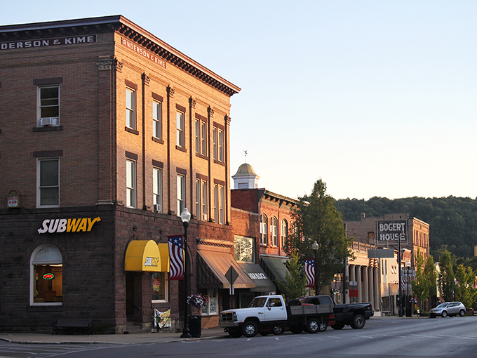 Downtown Ridgway's historic brick buildings aren't just preserved&mdash;they're alive with stories. That warm sunset glow makes the Anderson & Kime Building look like it's blushing from all the attention.