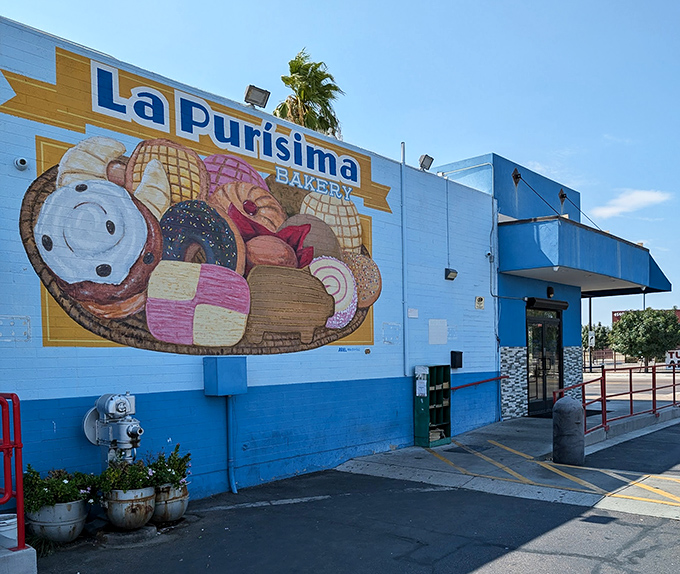 The blue and white exterior of La Purisima stands like a desert oasis, promising authentic Mexican flavors beneath the watchful Arizona palms.