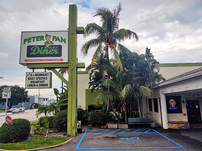 The iconic green and white sign welcomes hungry travelers like a beacon of breakfast hope. Palm trees and promise await.